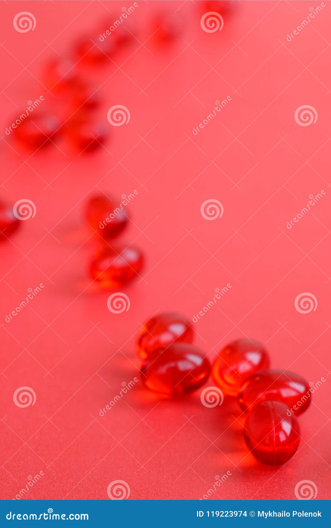 A Lot of Transparent Red Tablets Lie on the Red Surface Stock Photo ...