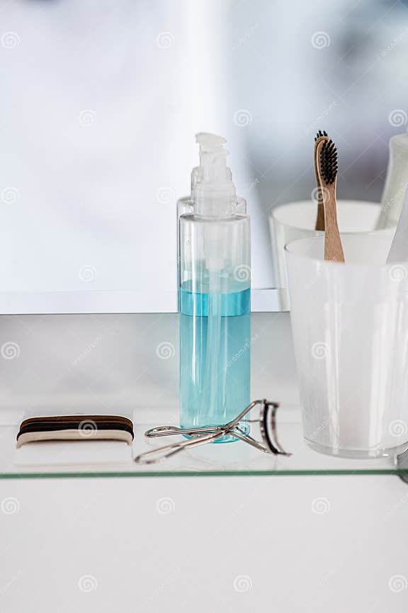 Lotion, Toothbrush and Paste on Mirror in Bathroom Stock Image - Image ...