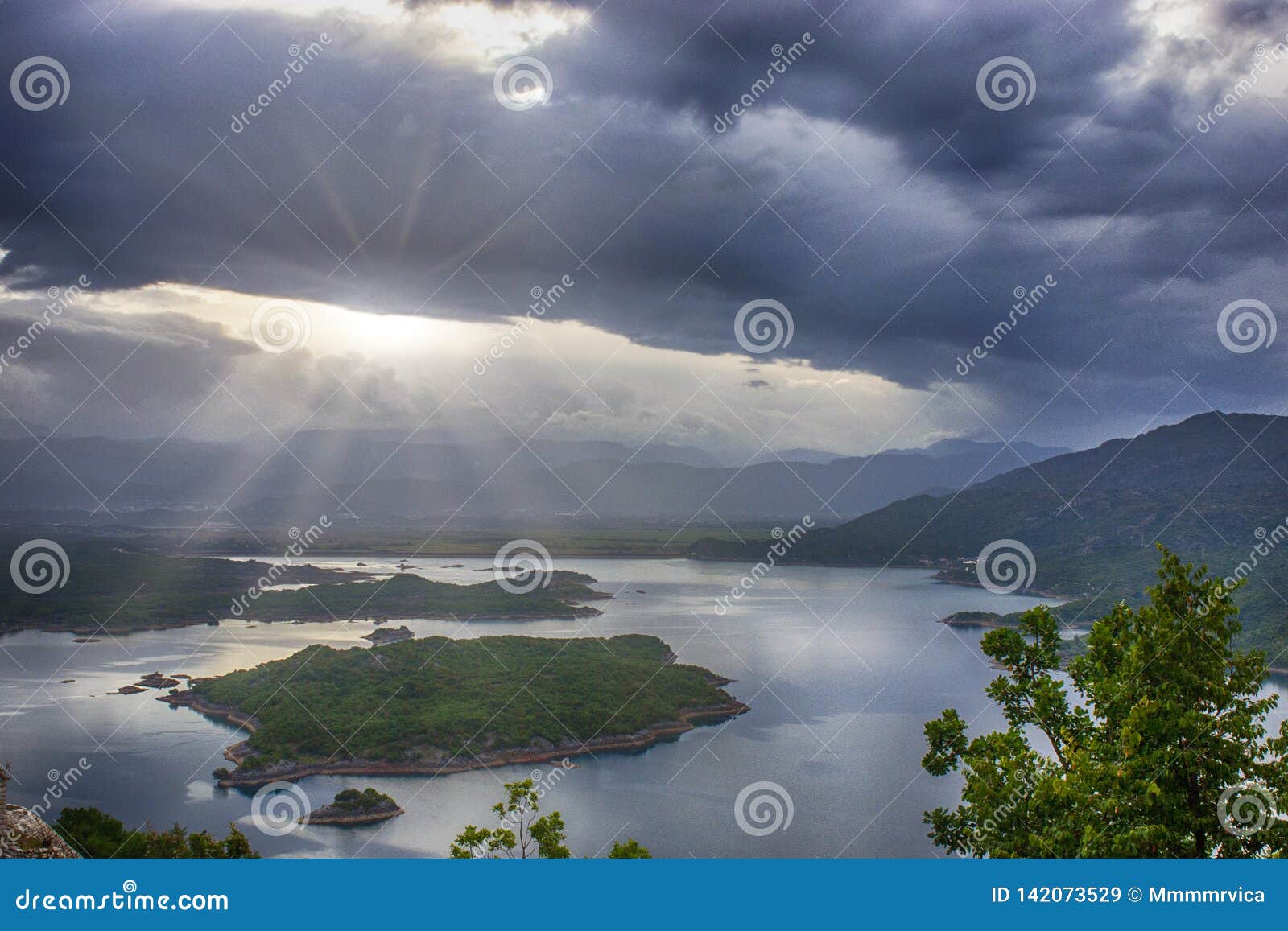 Lots of Clouds and Sun Rays Above the Lake Stock Image - Image of lake ...