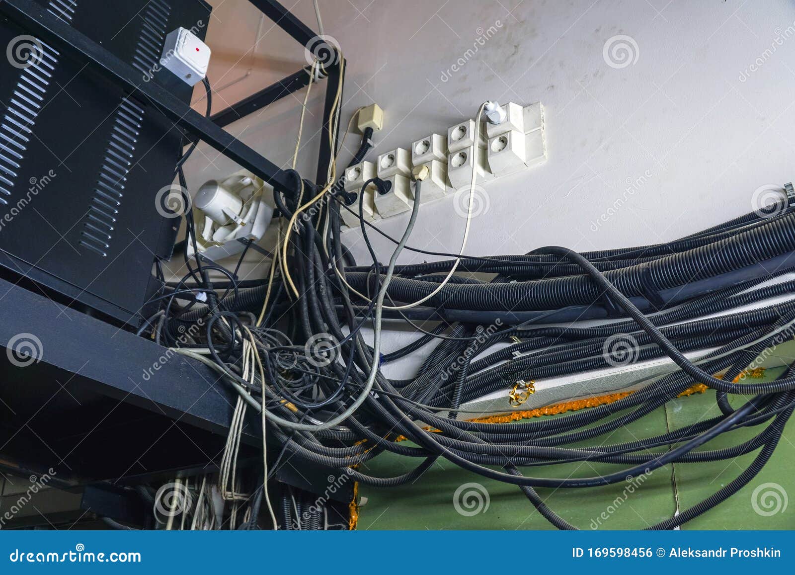 Lots of Different Cables Hanging in a Mess on the Wall Stock Photo ...
