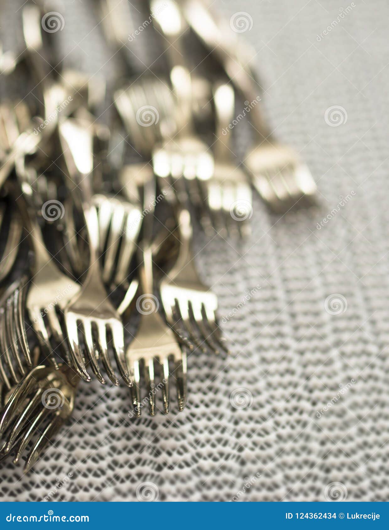Lots of forks on the table stock photo. Image of pile - 124362434