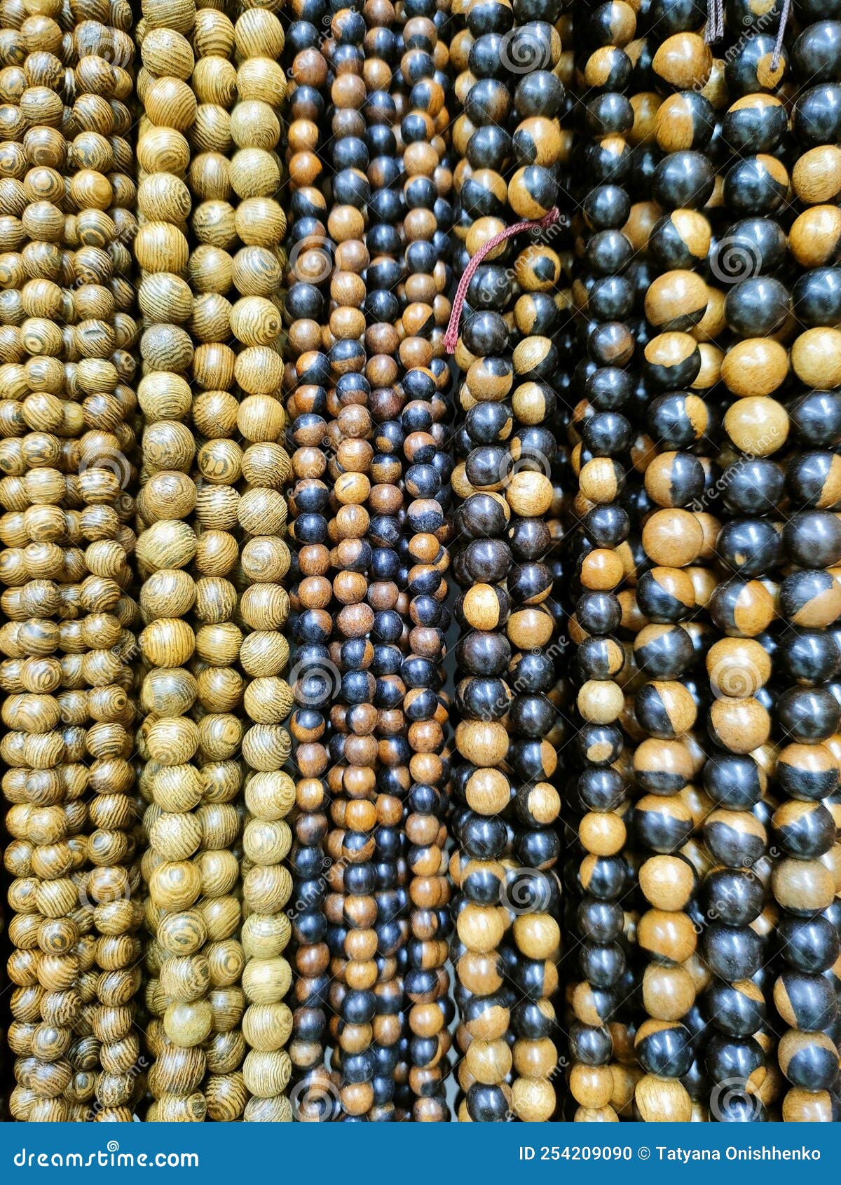 Lots of Threads with Wooden Beads Hanging in Rows on the Wall Stock ...