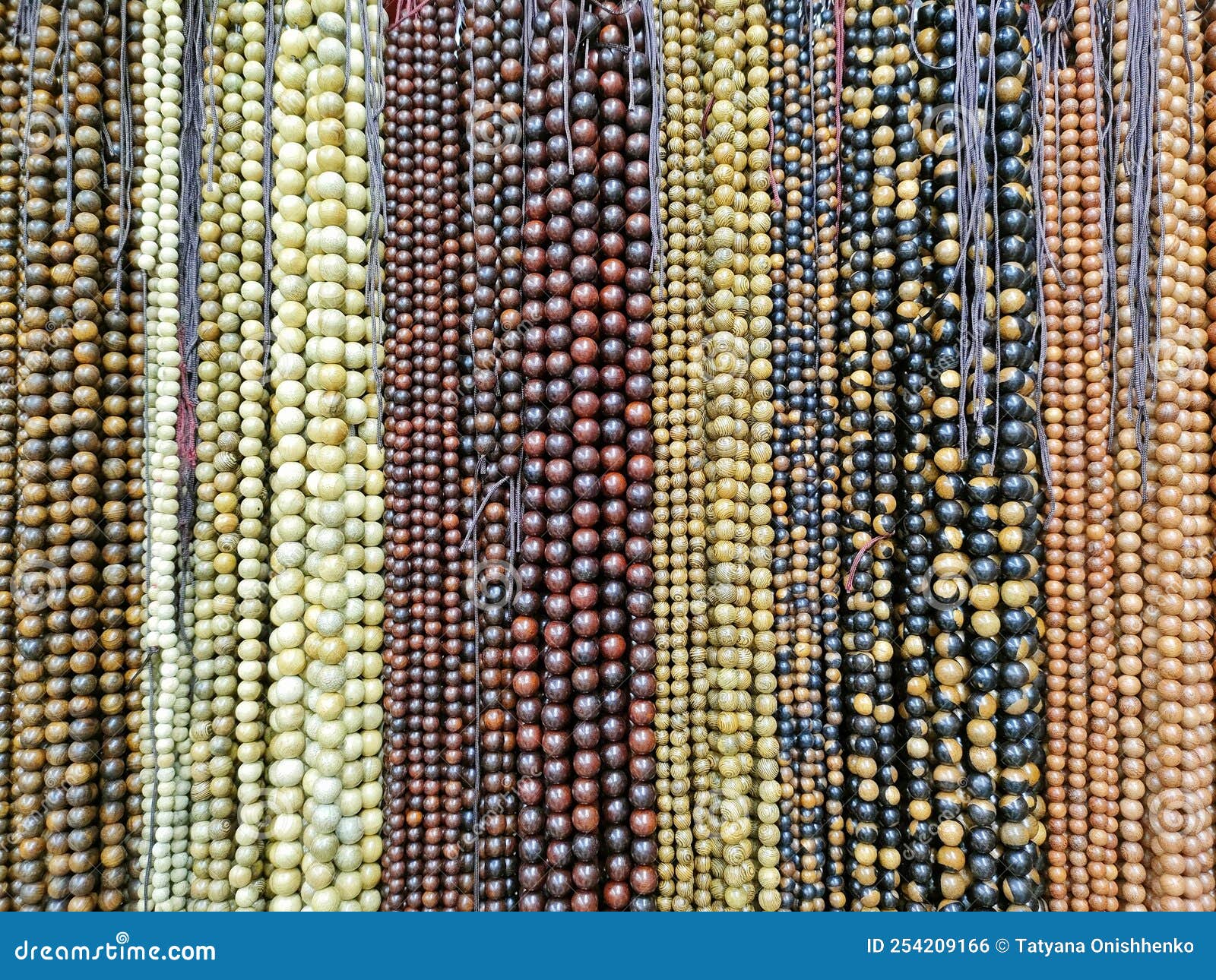 Lots of Threads with Wooden Beads Hanging in Rows on the Wall Stock ...