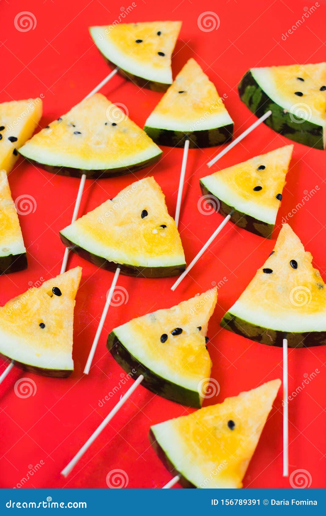 A Lots of Triangular Pieces of Ice Cream on a Stick of Ripe Yellow ...