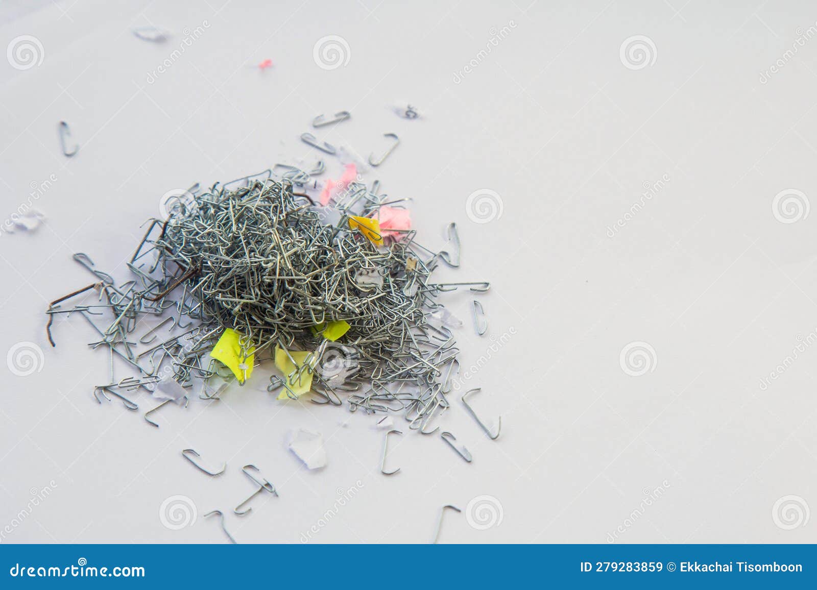 Staples Piled On White Paper Background Next To A Big Stapler Stock ...