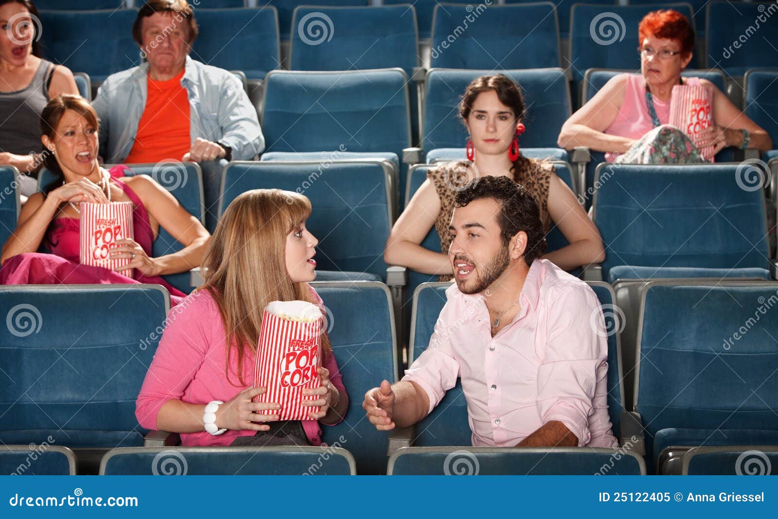 Loud Couple in Theater stock image. Image of conversation - 25122405