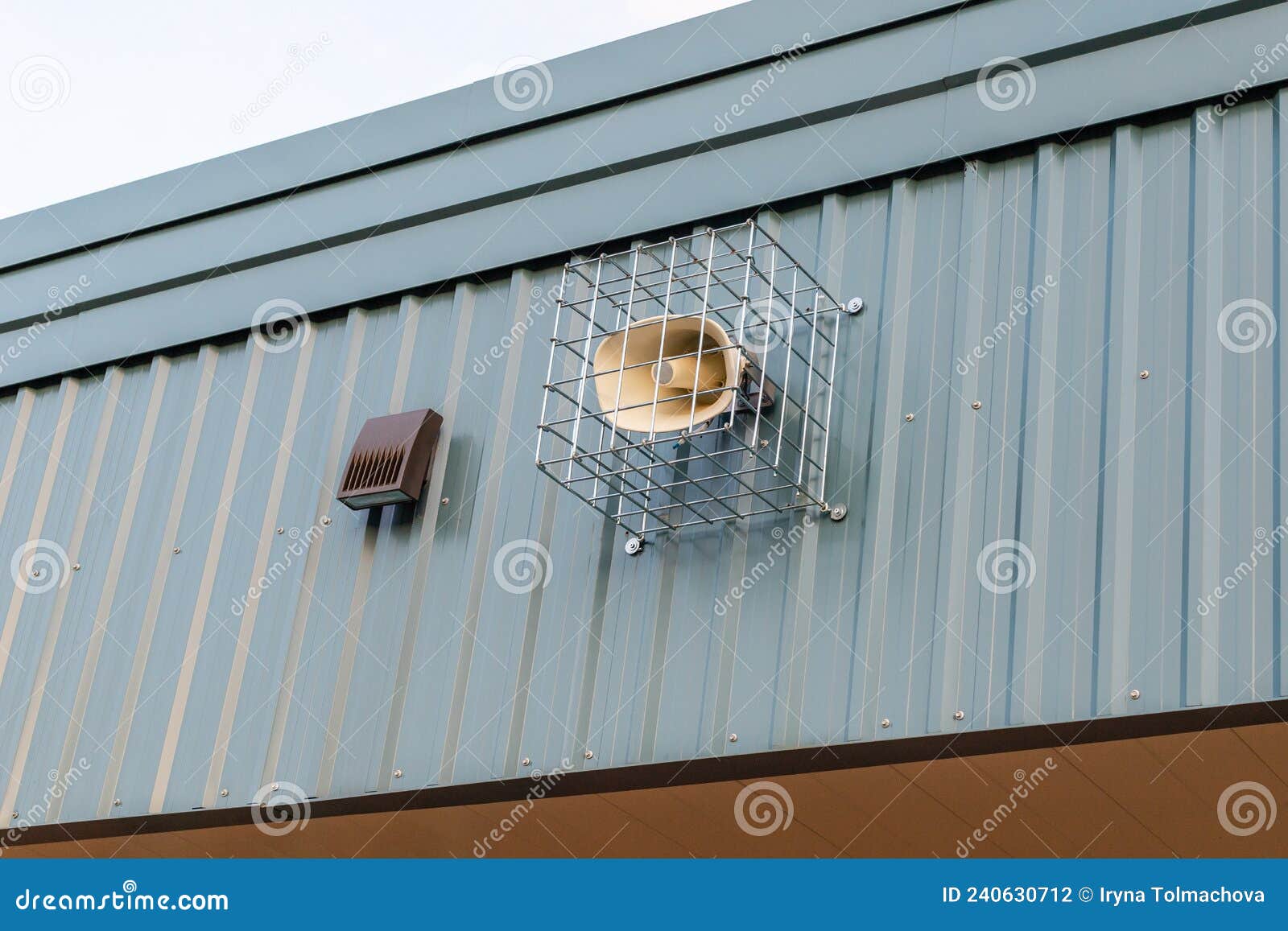 Loudspeaker on a Wall. Megaphone on School Building. Stock Photo ...