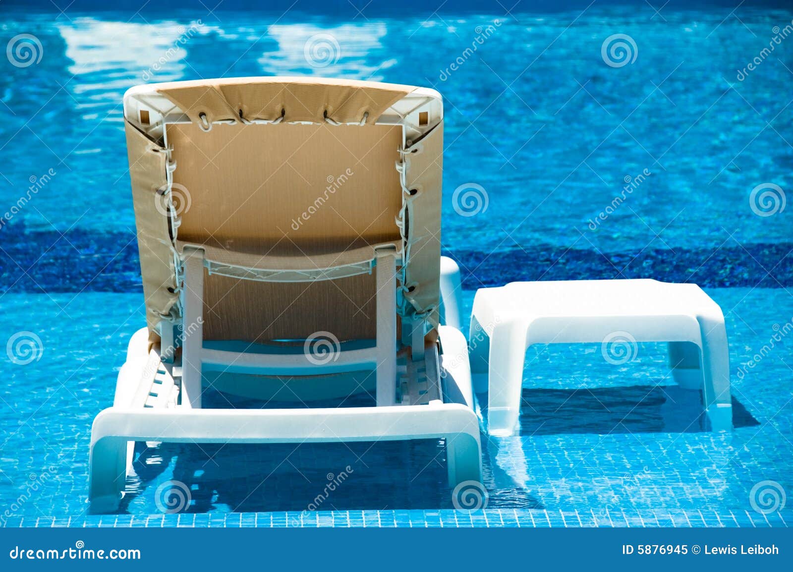 Lounge Chair in the Pool stock image. Image of poolside - 5876945