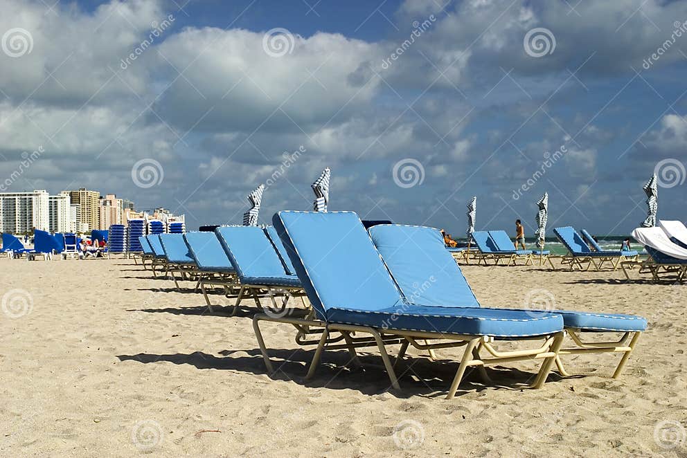 Lounge chairs on the beach stock photo. Image of beach - 1800616