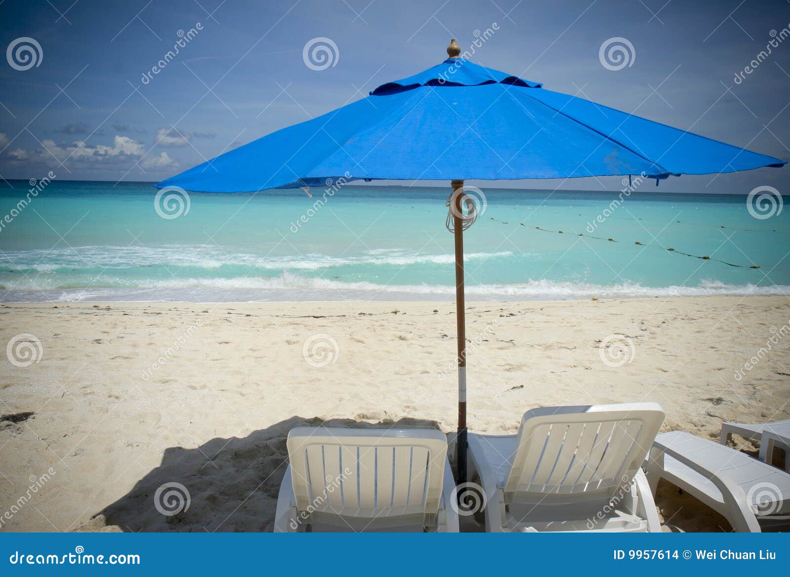 Lounge chairs at the beach stock photo. Image of scenery - 9957614