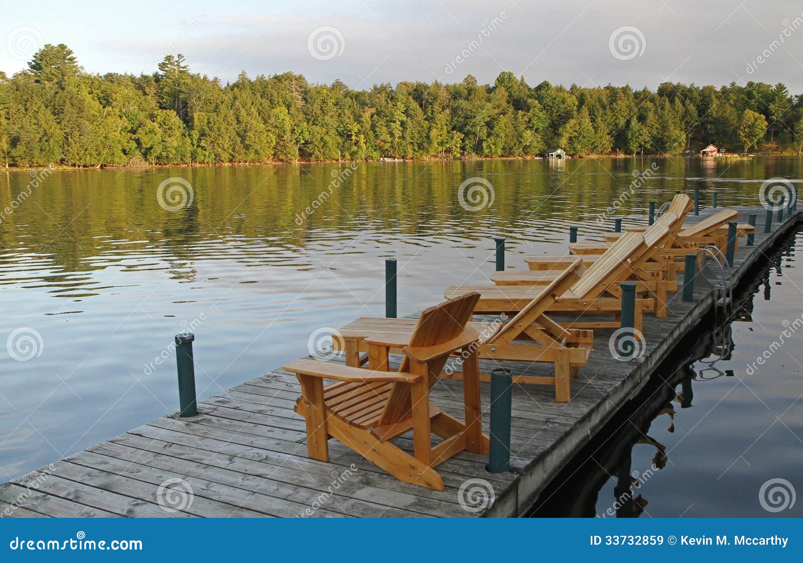 Lounge Chairs on a Pier stock image. Image of outdoors - 33732859