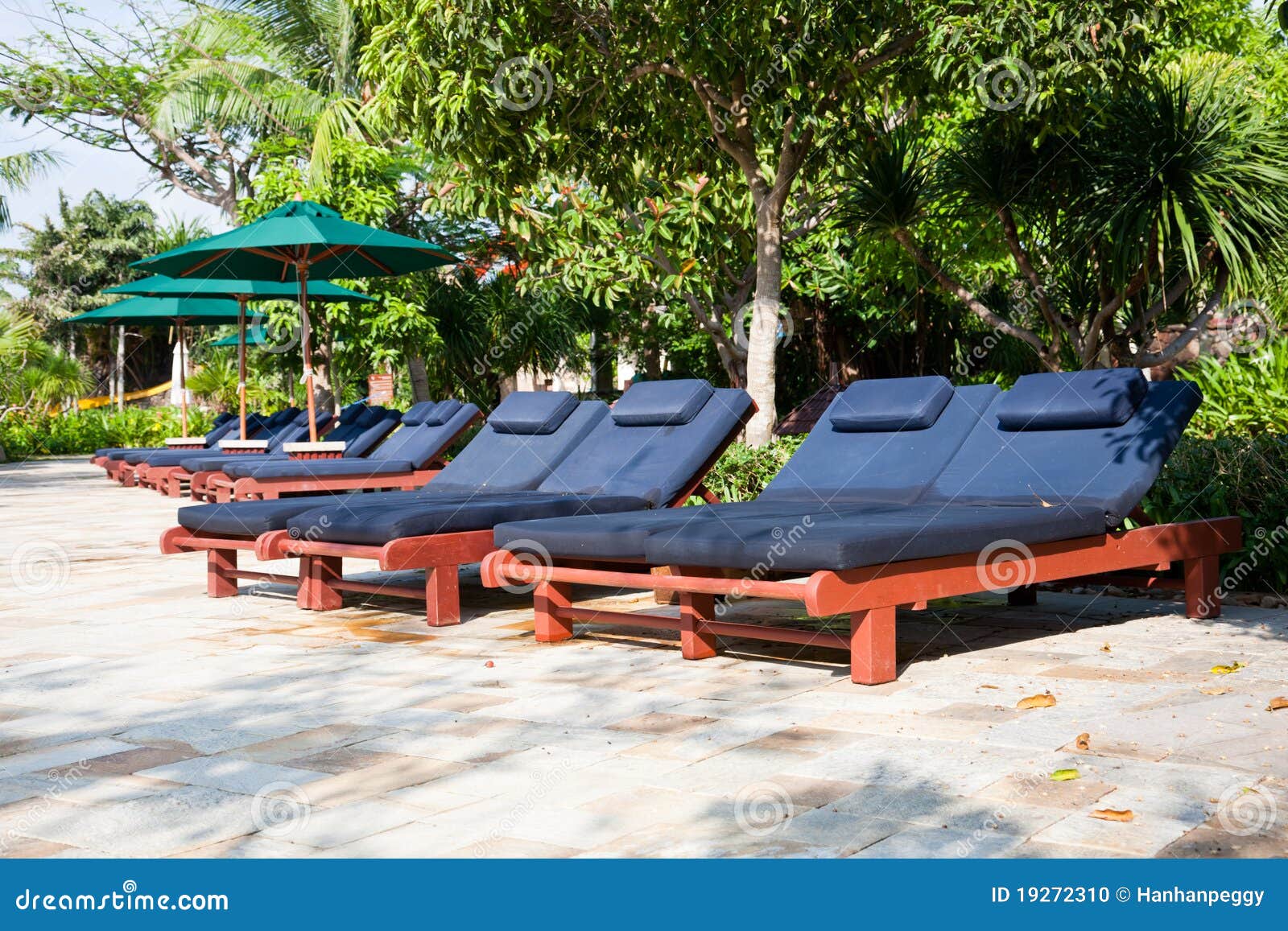 Lounge Chairs and Sunshades Stock Photo - Image of holiday, formal ...