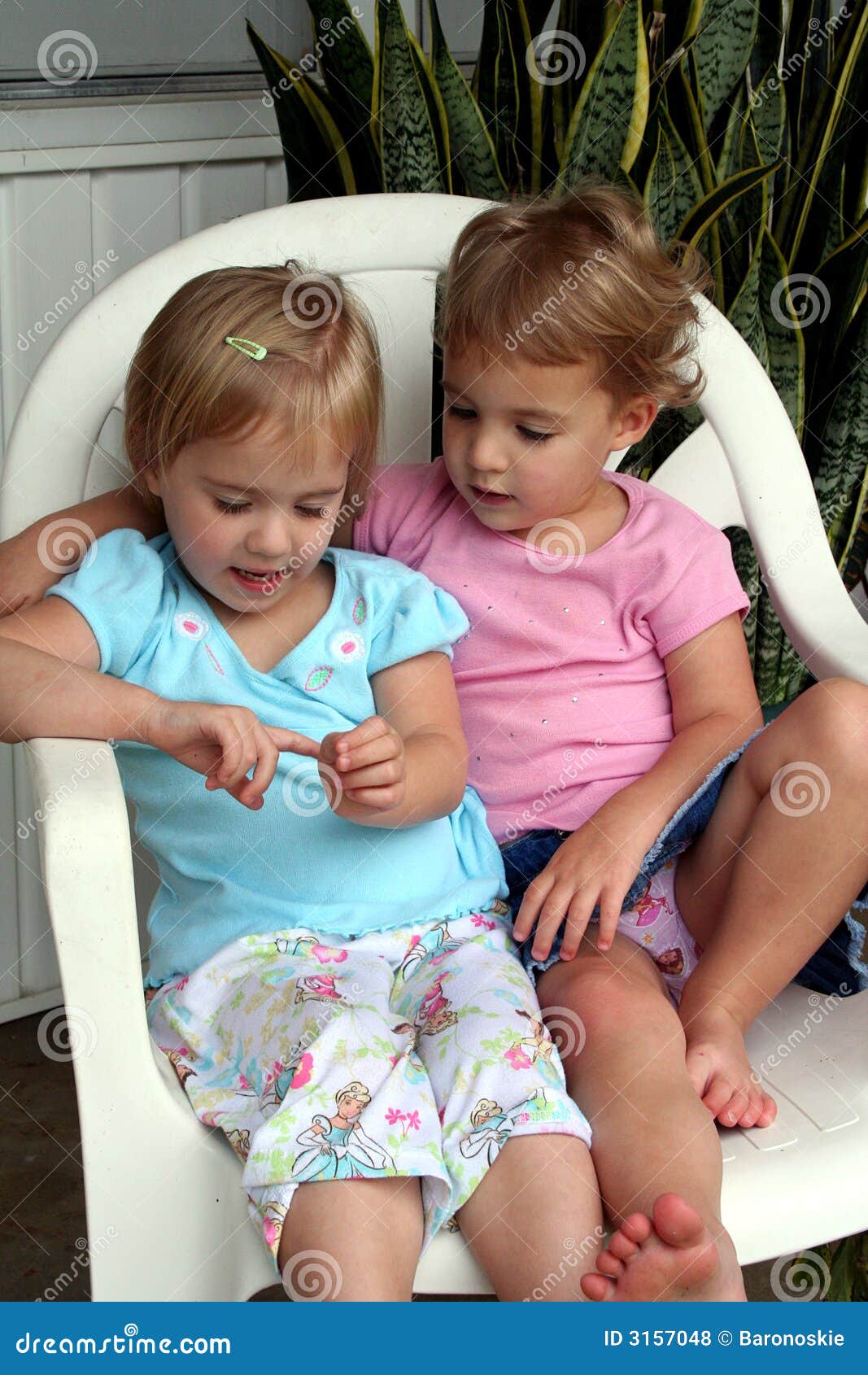 Lounging Girls stock photo. Image of relax, kids, chair - 3157048