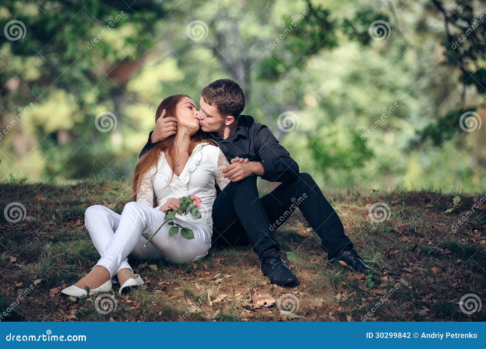 Love and Affection between a Young Couple Stock Photo - Image of grass ...