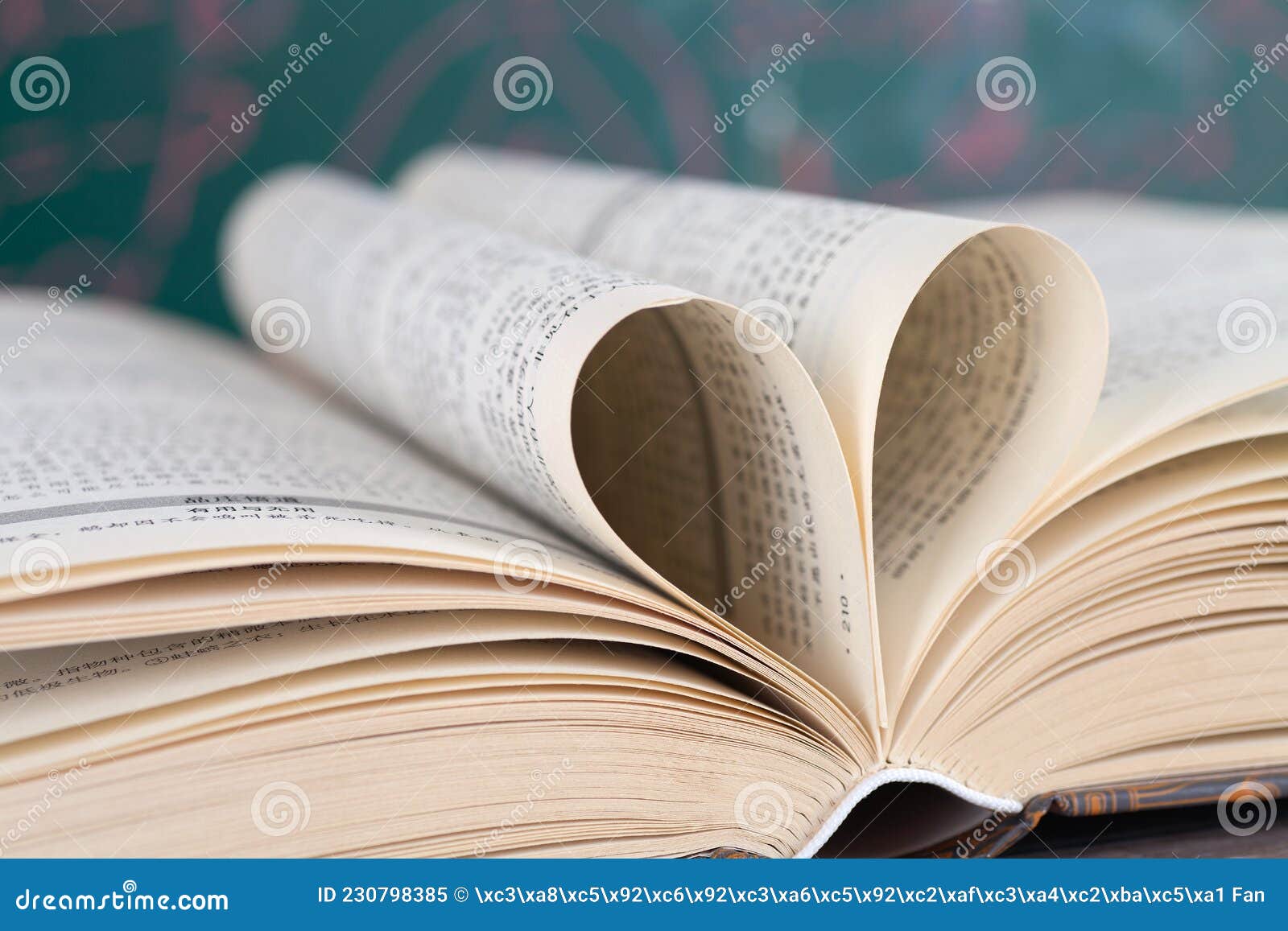 Love Folded from an Open Book in Front of the Blackboard Stock Image ...