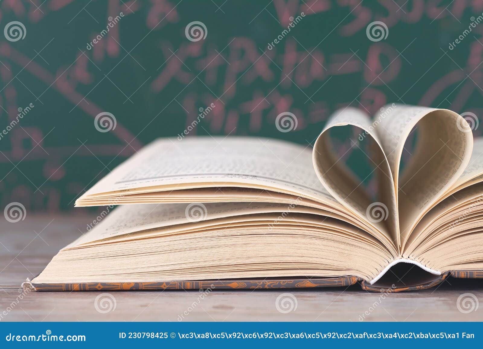 Love Folded from an Open Book in Front of the Blackboard Stock Image ...