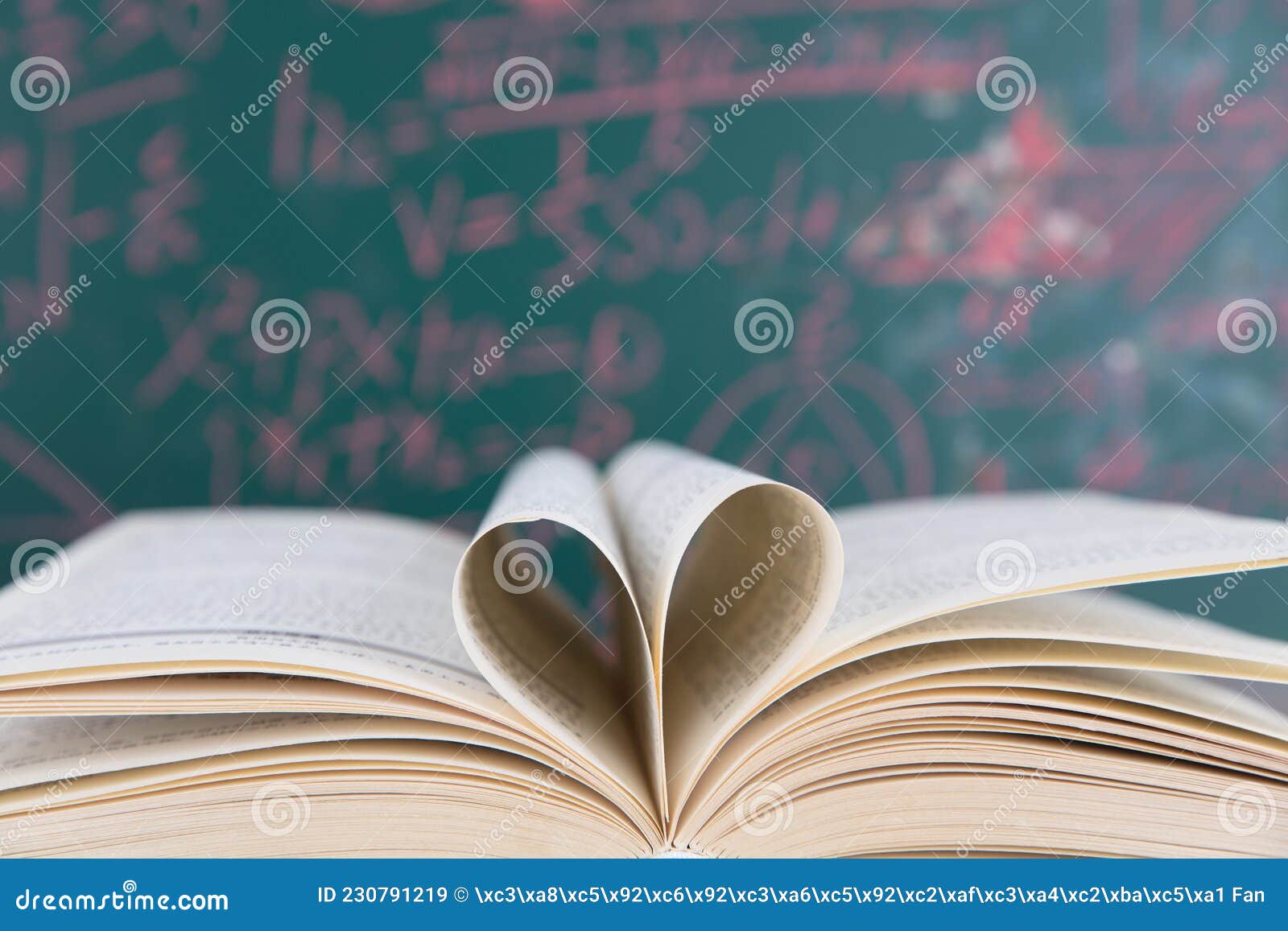 Love Folded from an Open Book in Front of the Blackboard Stock Image ...