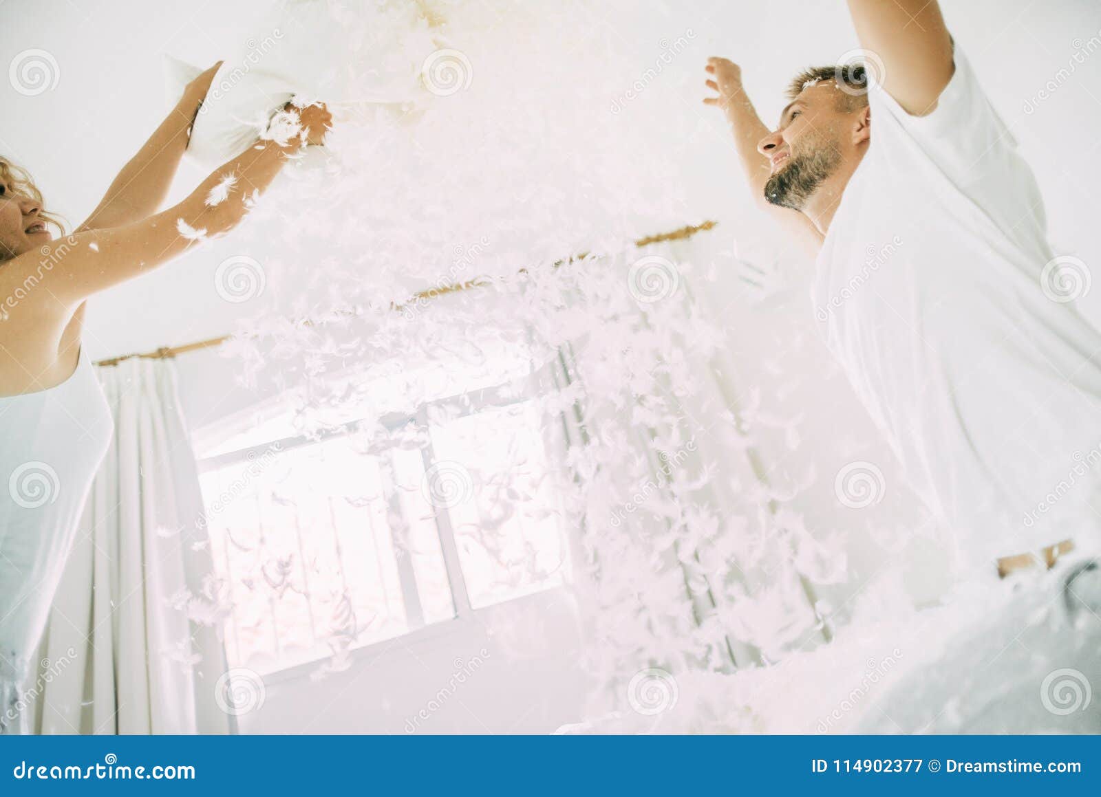 Love Happy Couple in the Bedroom with Feathers Stock Image - Image of ...