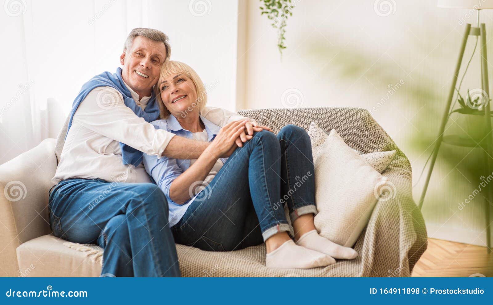 Love Lives Forever Loving Senior Couple Embracing Sitting On Sofa