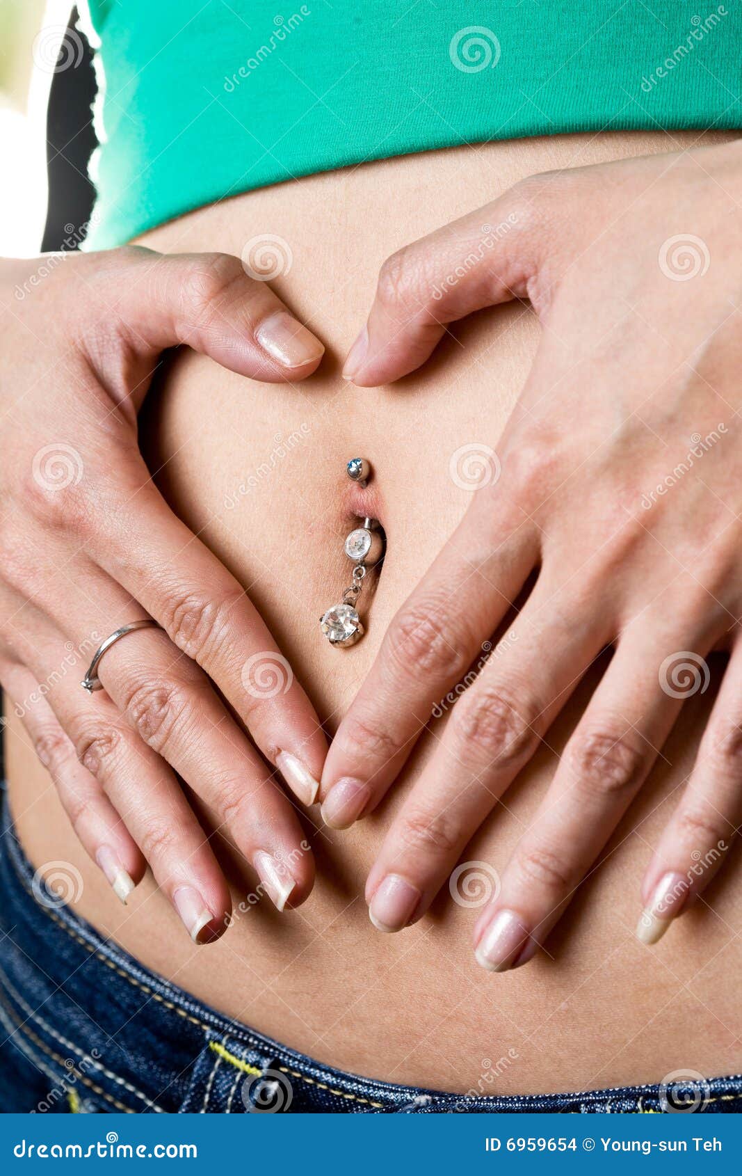 Love Shape Hand Sign on Tummy Stock Photo - Image of piercing, sign ...