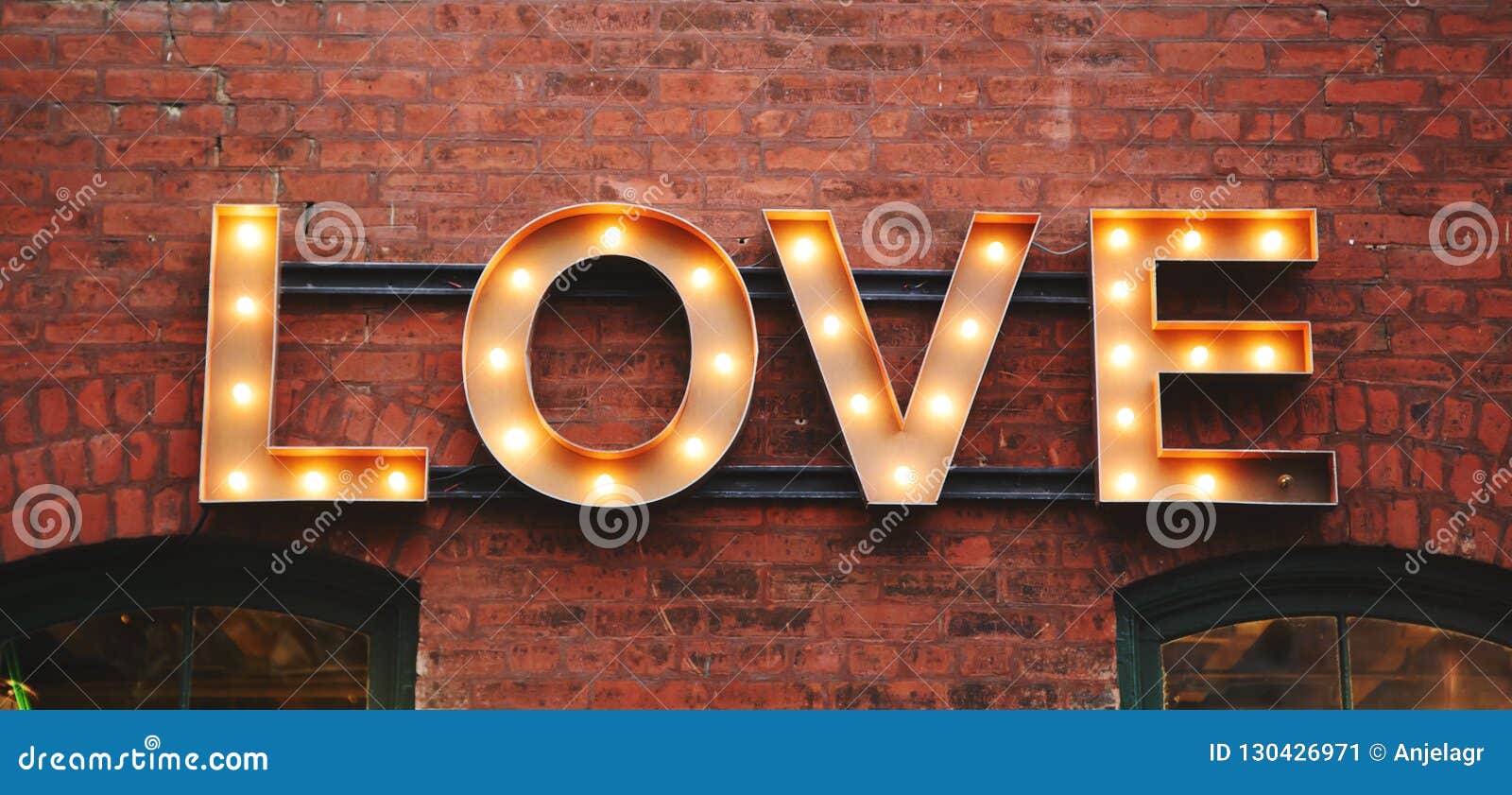 Love Sign Hangs on a Brick Wall Stock Image - Image of attraction, city ...