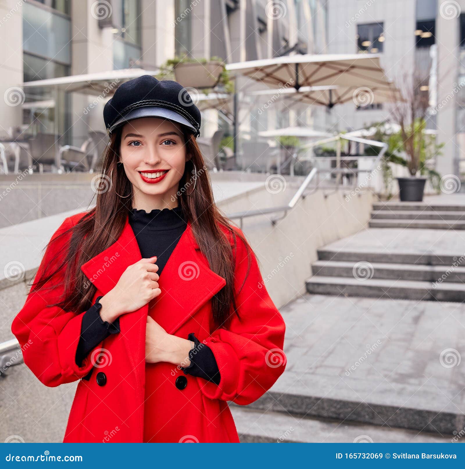 Admirable Ravishing Dreamy Girl Holds Her Black Kepi By Hand And Looks