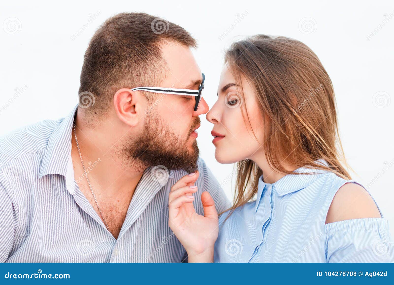 Lovely Attractive Couple Sitting Together On The White Sand Beach