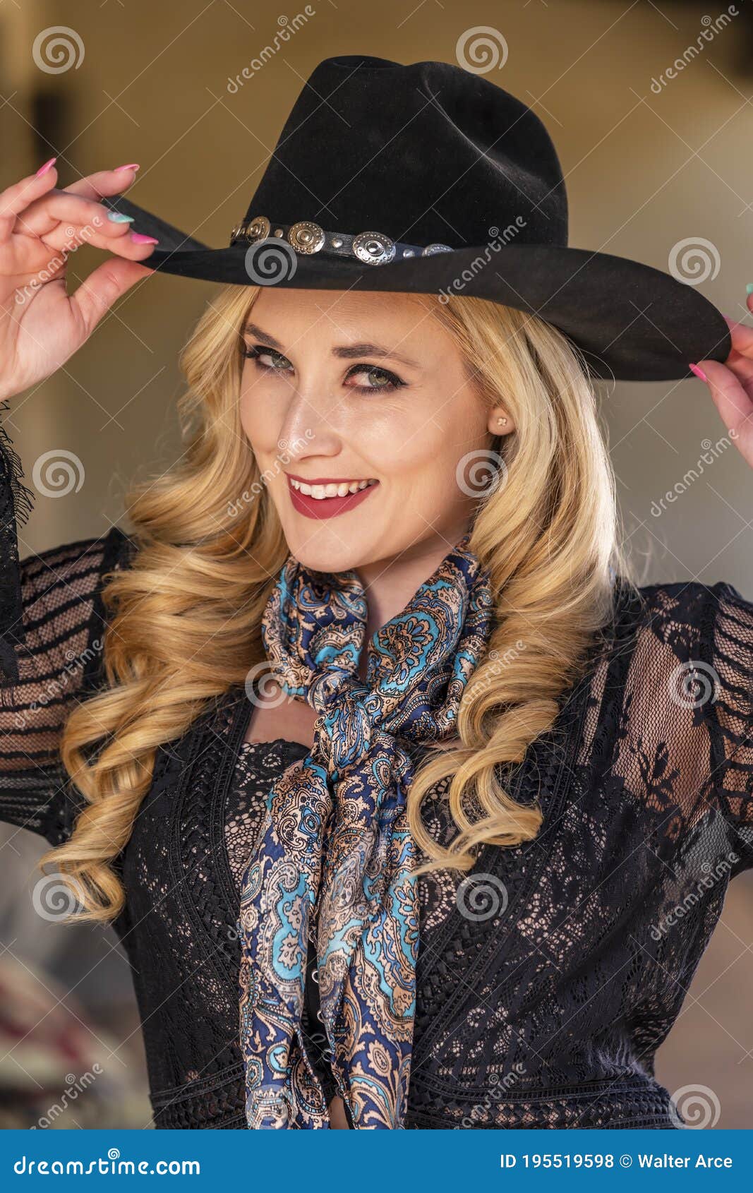 A Lovely Blonde Model Dressed As A Cowgirl Enjoys The American West