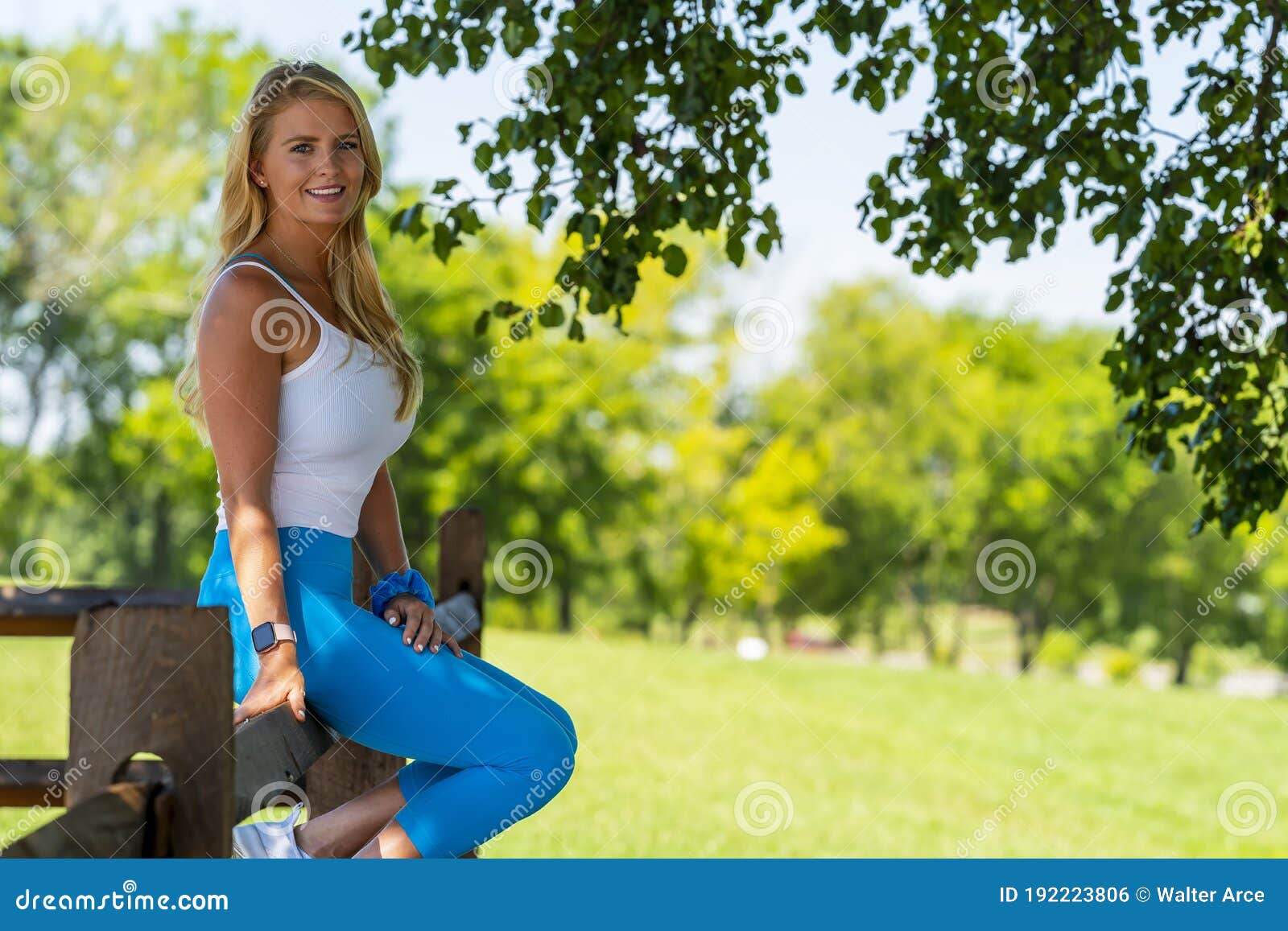 A Lovely Blonde Model Poses Outdoors While Enjoying A Summers Day Stock