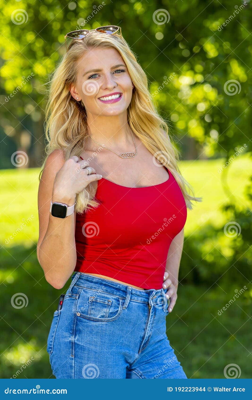 A Lovely Blonde Model Poses Outdoors While Enjoying A Summers Day Stock