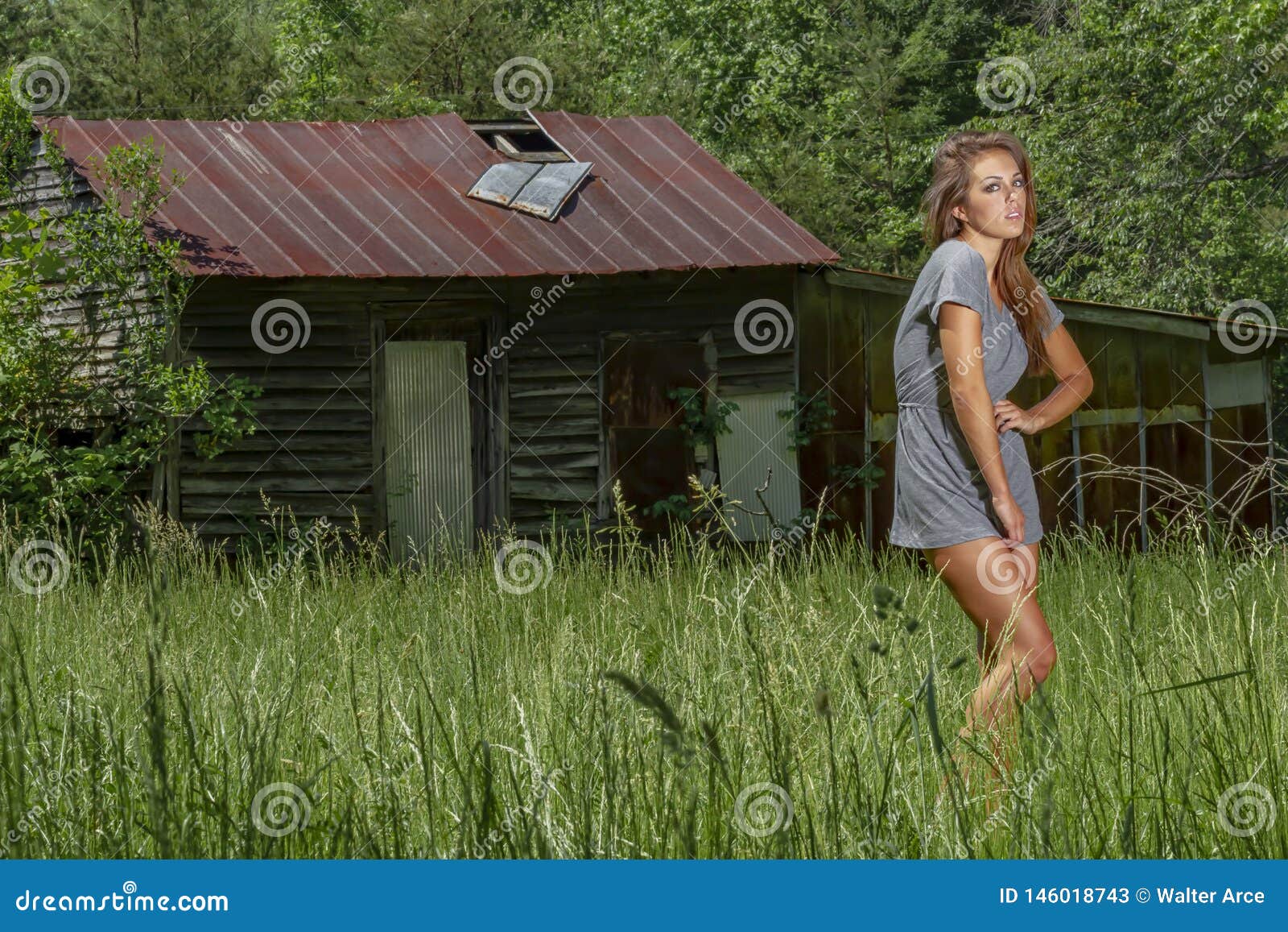 Lovely Brunette Bikini Model Posing Outdoors In A Rural Environment