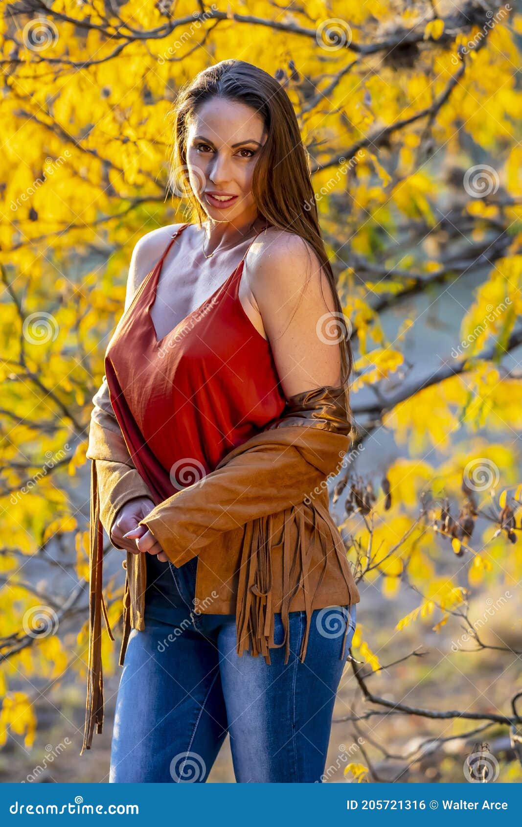 A Lovely Brunette Model Poses Outdoor While Enjoying The Fall Weather