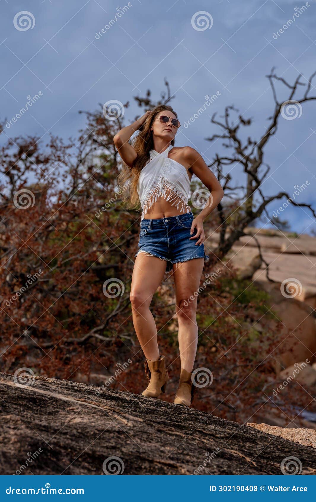 A Lovely Brunette Model Poses Outdoors While Enjoying The Fall Weather
