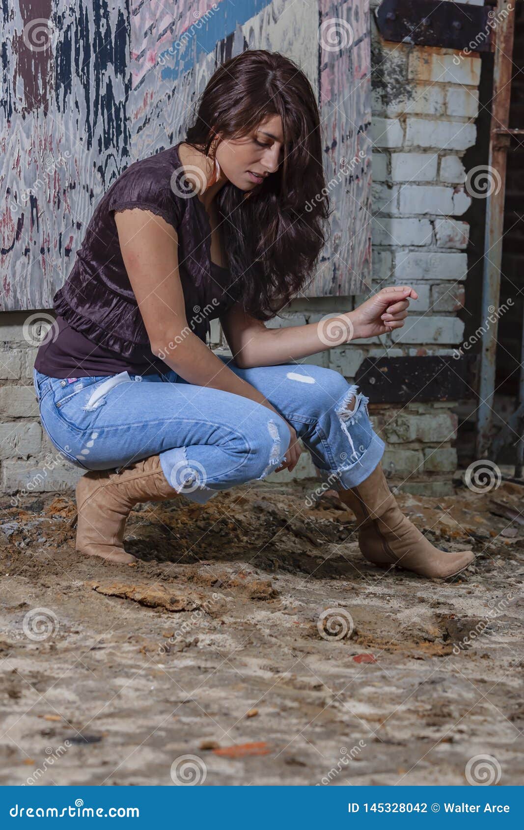 A Lovely Brunette Model Posing Outdoors With The Latest Fashions Stock