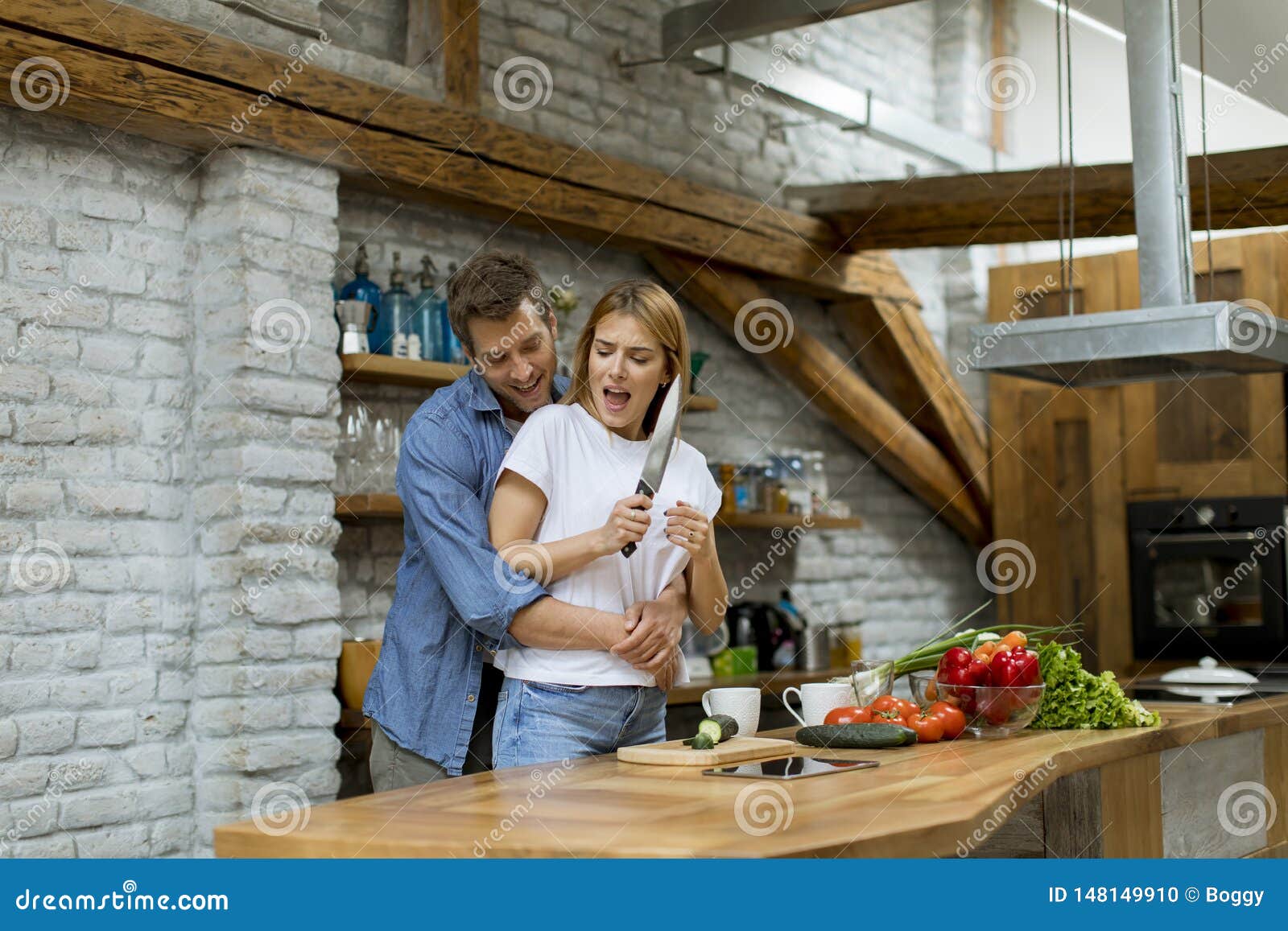 Lovely Cheerful Couple Cooking Dinner Together and Having Fun at Rustic ...