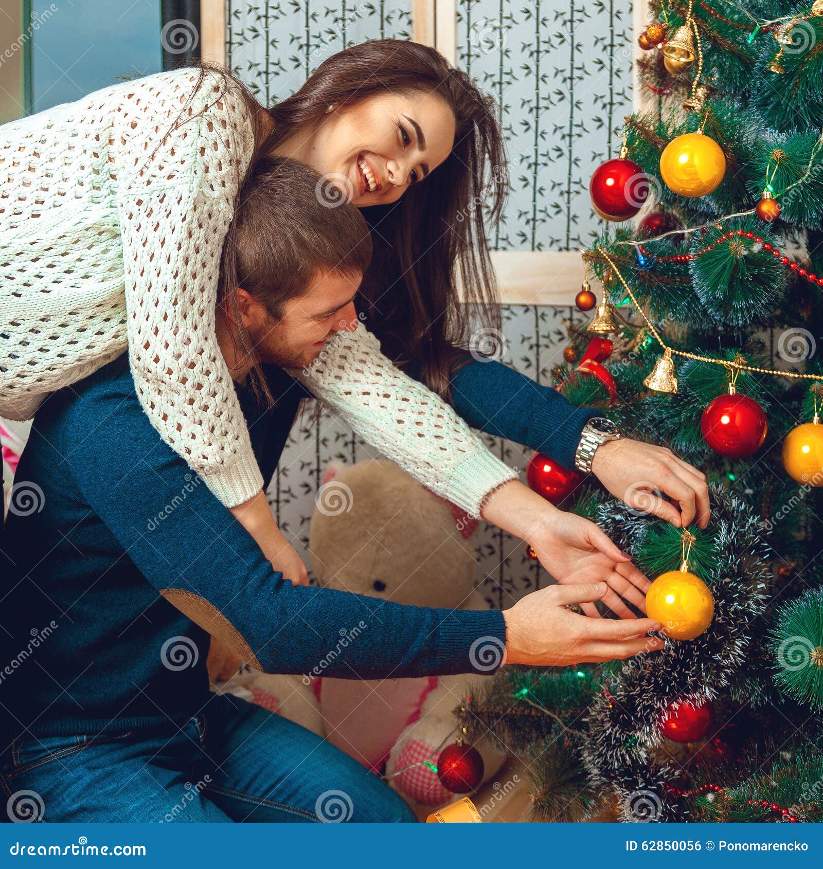 Lovely Couple Decorates Christmas Tree Stock Photo - Image of couple ...