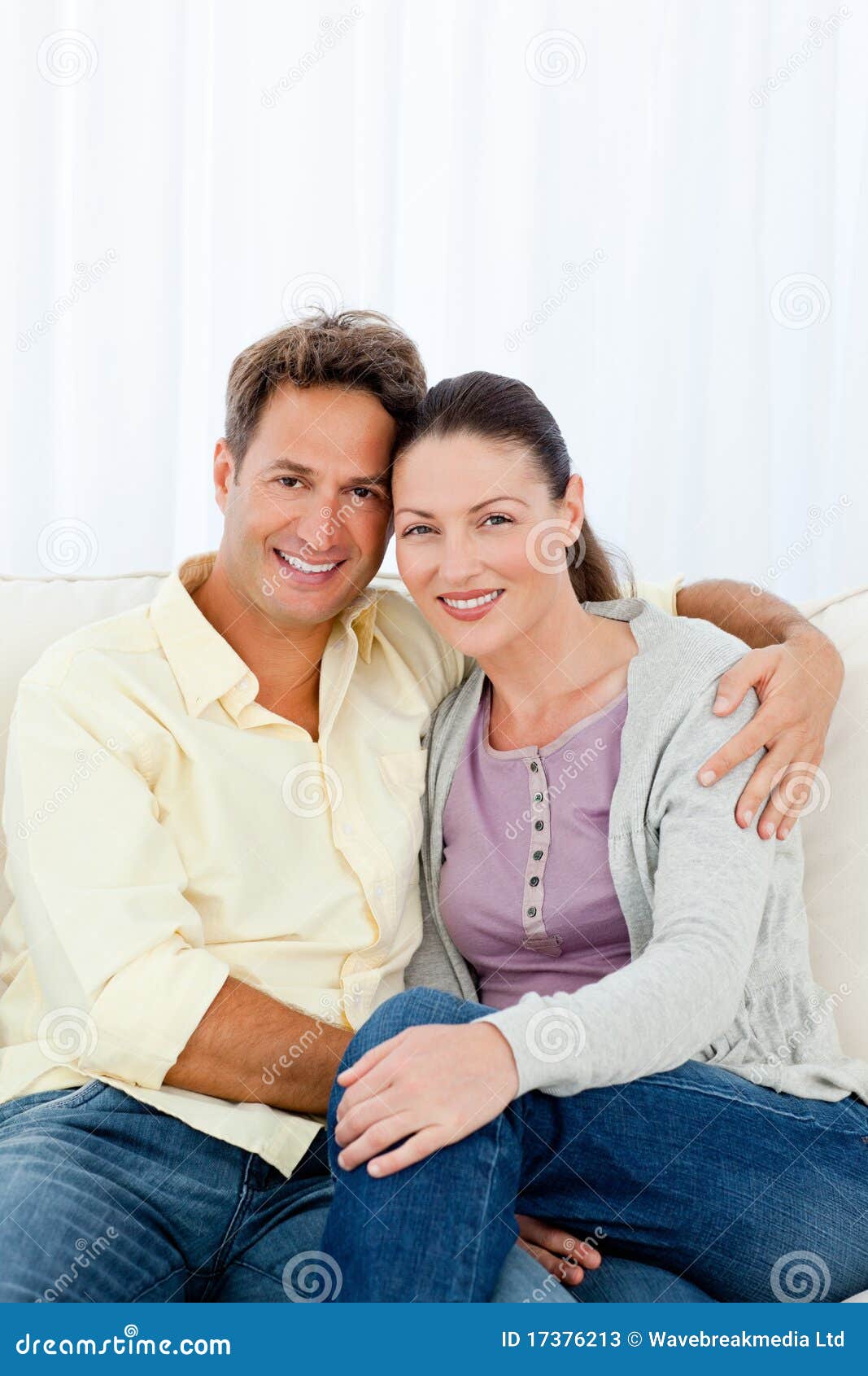 Lovely Couple Hugging Sitting on the Sofa Stock Image - Image of ...