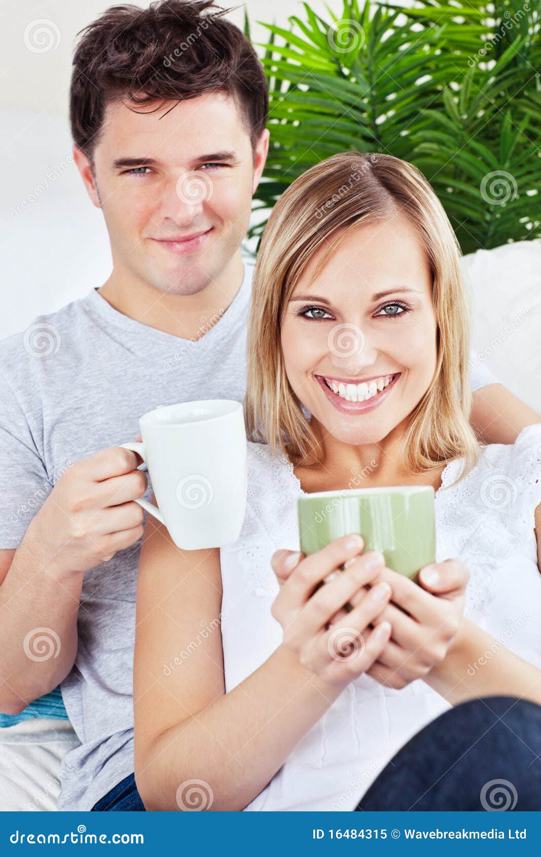 Lovely Couple Resting on the Sofa with Coffee Stock Image - Image of ...