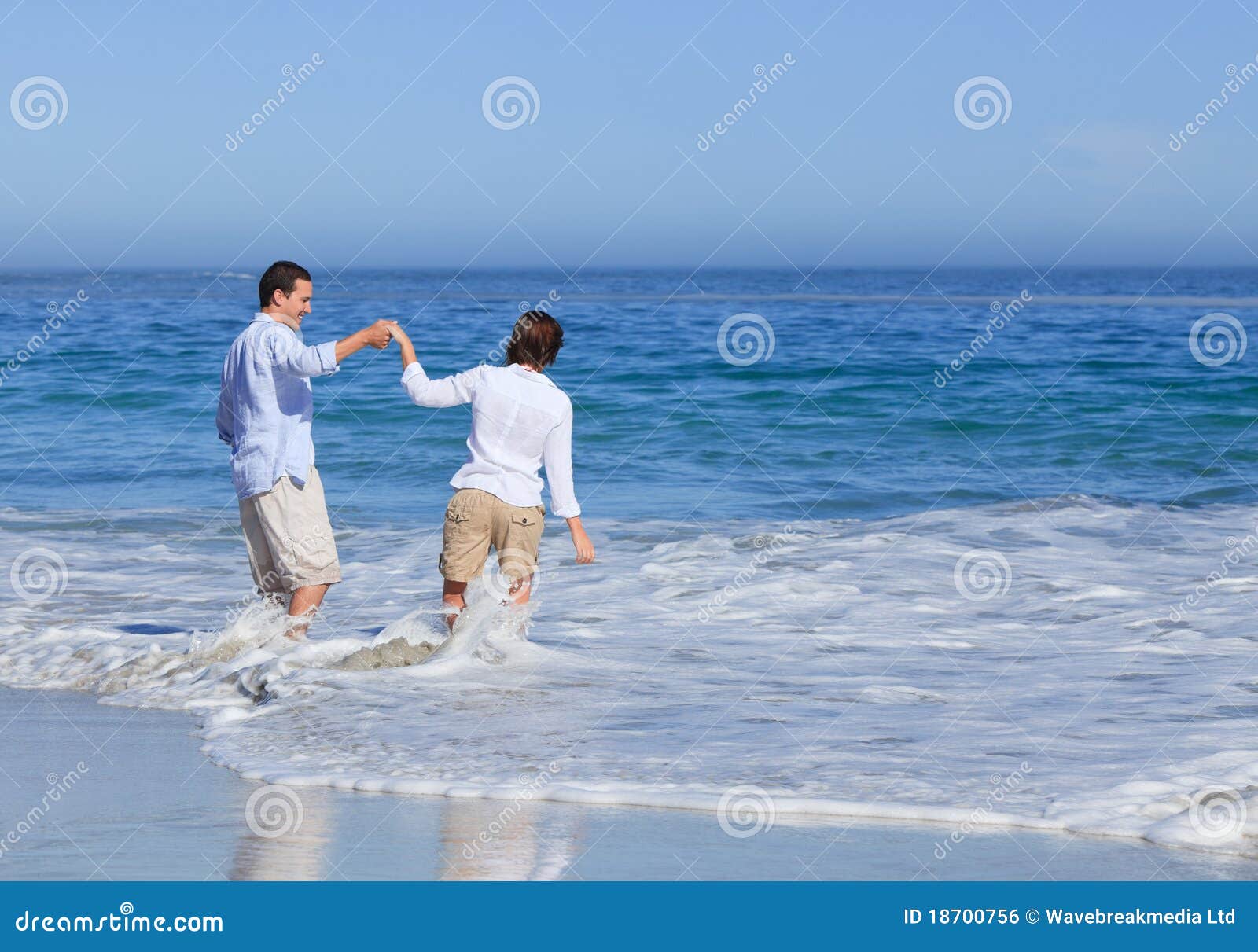 Lovely couple in the sea stock photo. Image of adult - 18700756