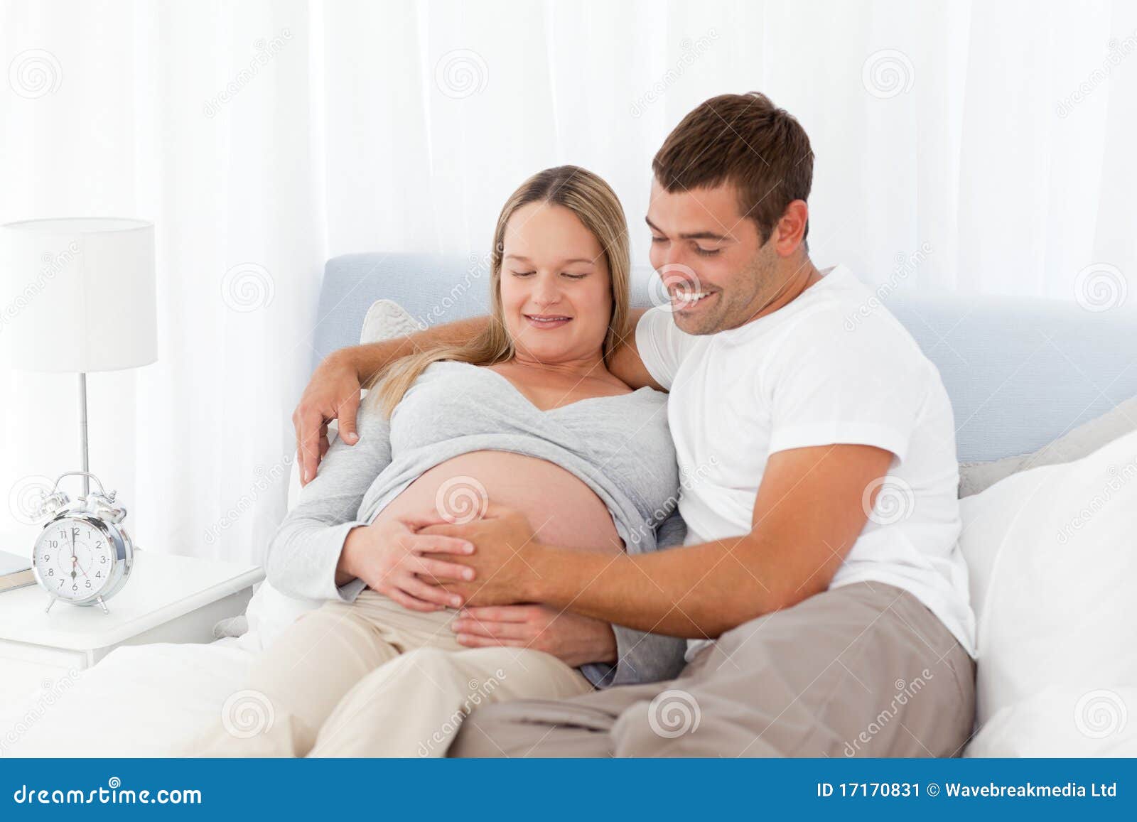 Lovely Future Parents Lying on a Bed Stock Image - Image of belly ...