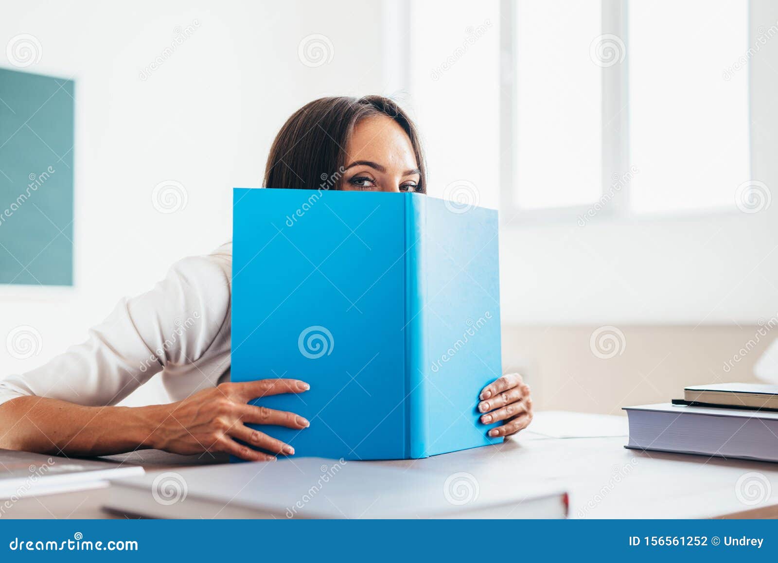 Lovely Girl Student Hiding Behind the Book Stock Photo - Image of girl ...