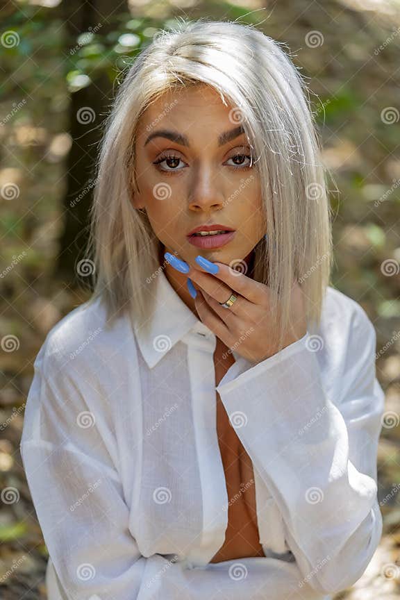 Lovely Implied Nude Blonde Model Enjoying A Day Near The Beach Stock