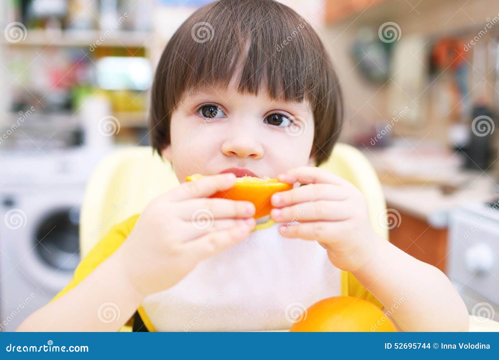 Lovely Little Child Eats Orange Stock Photo - Image of year, yearling ...