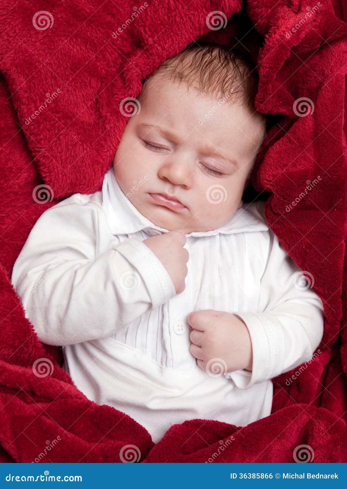 Lovely 3 Months Baby Sleeping on Bed Covered with Red Blanket Stock ...