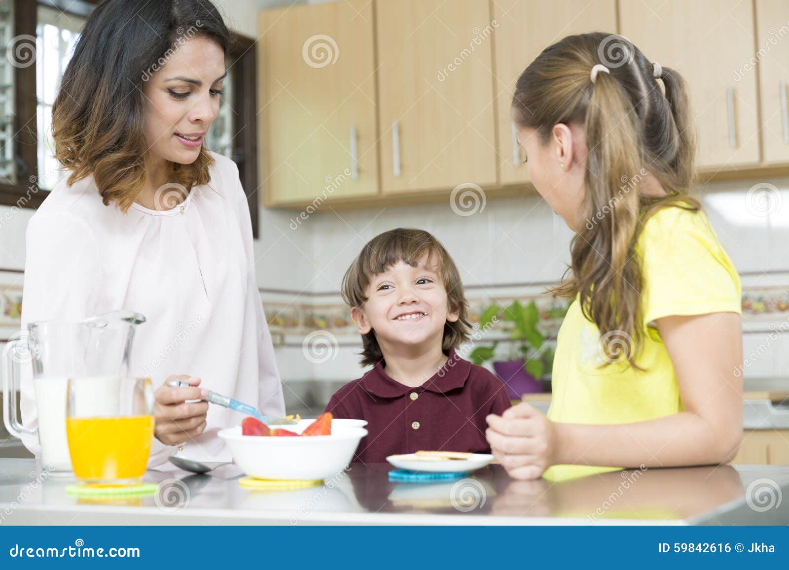Lovely Mother and Her Children Having Breakfast Stock Photo - Image of ...