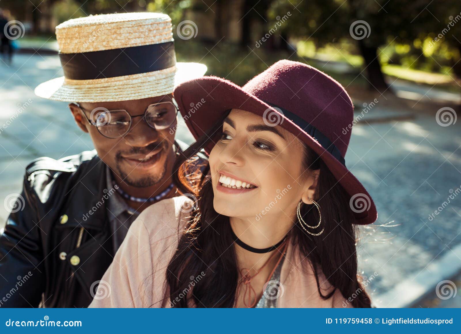Lovely Multicultural Couple in Hats Walking Stock Photo - Image of ...