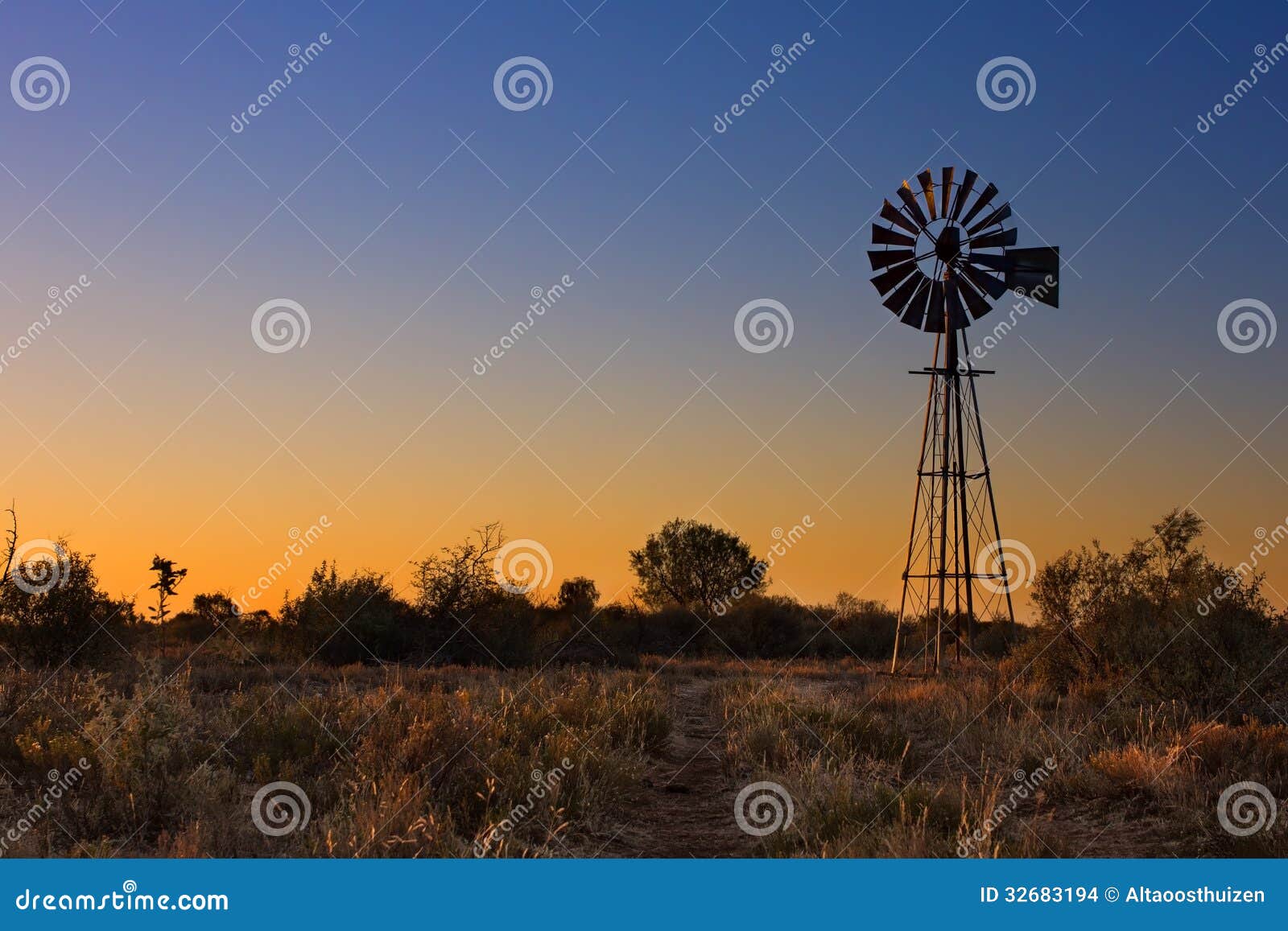 Lovely Sunset in Kalahari with Windmill and Grass Stock Photo - Image ...