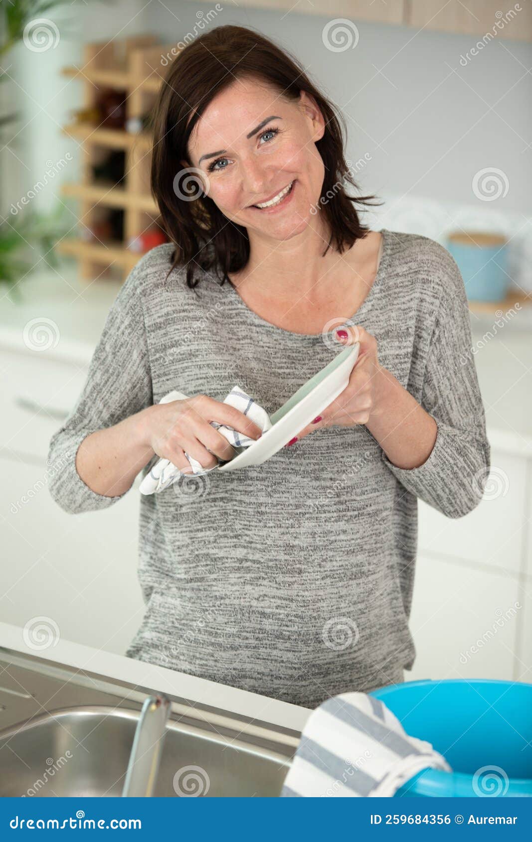 Lovely Woman Standing in Kitchen Drying Plate Stock Photo - Image of ...