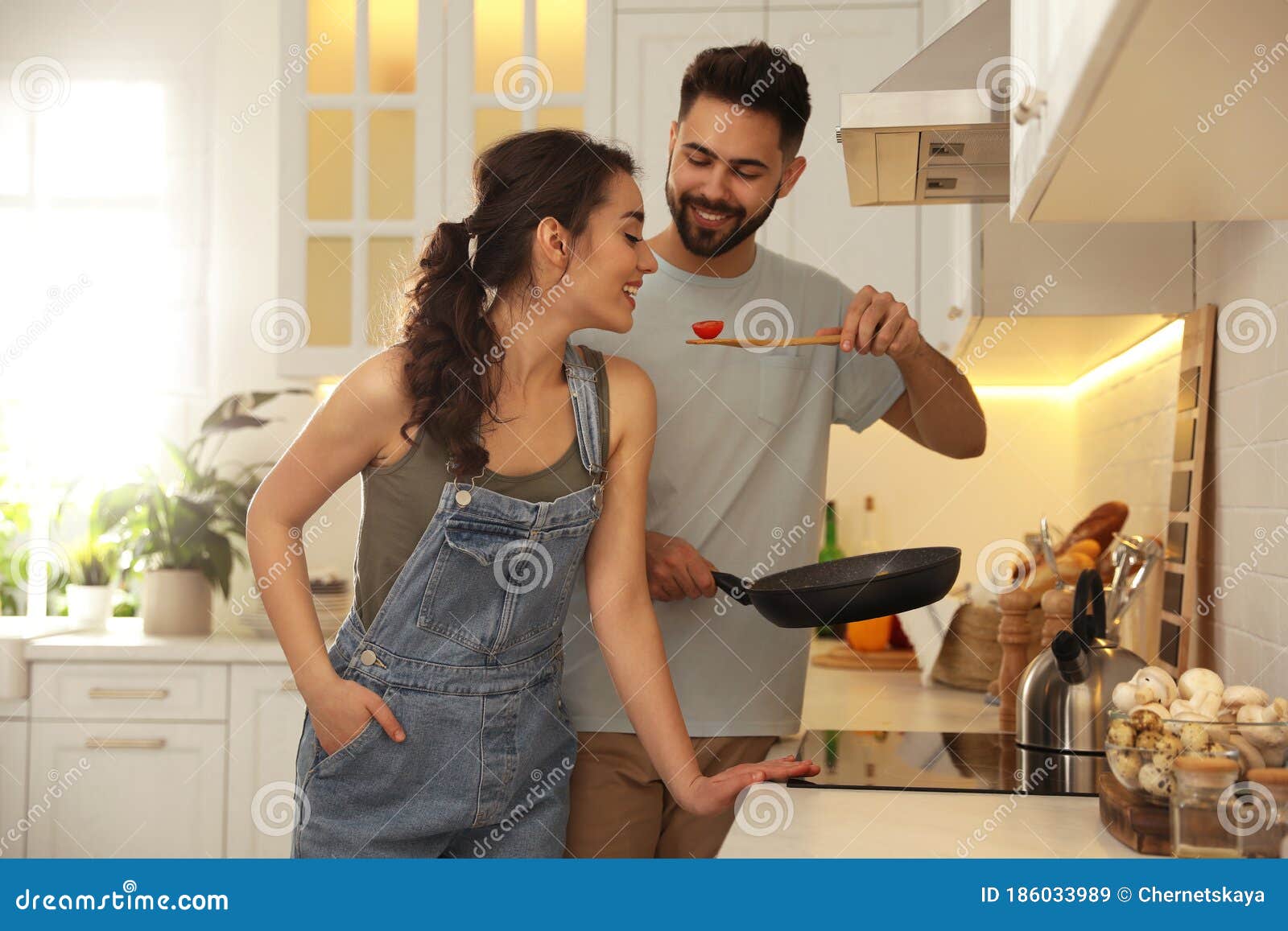 Lovely Young Couple Cooking in Kitchen Stock Image - Image of meal ...