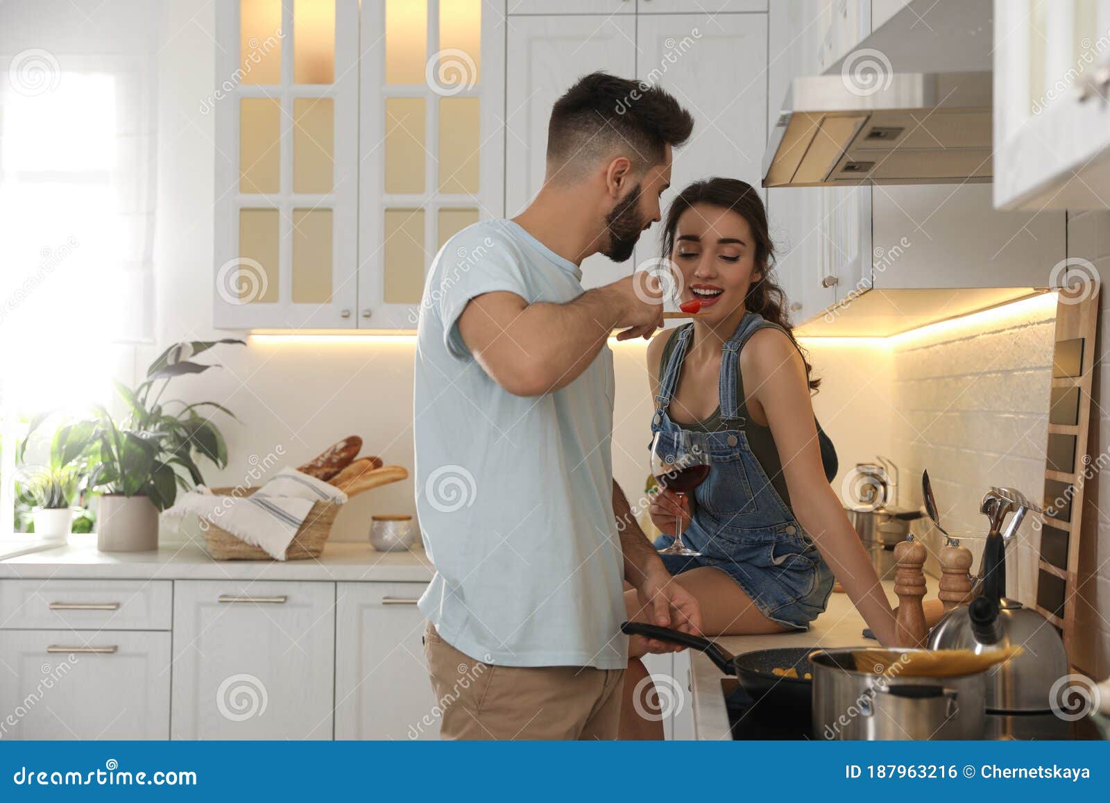 Lovely Young Couple Cooking in Kitchen Stock Photo - Image of female ...
